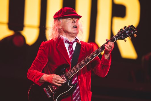 Angus and Malcolm Young: The Bond That Built AC/DC’s Legacy | Woman's World